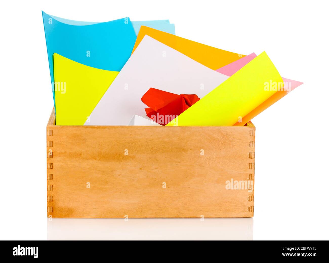 Wooden crate with colorful papers isolated on white Stock Photo - Alamy
