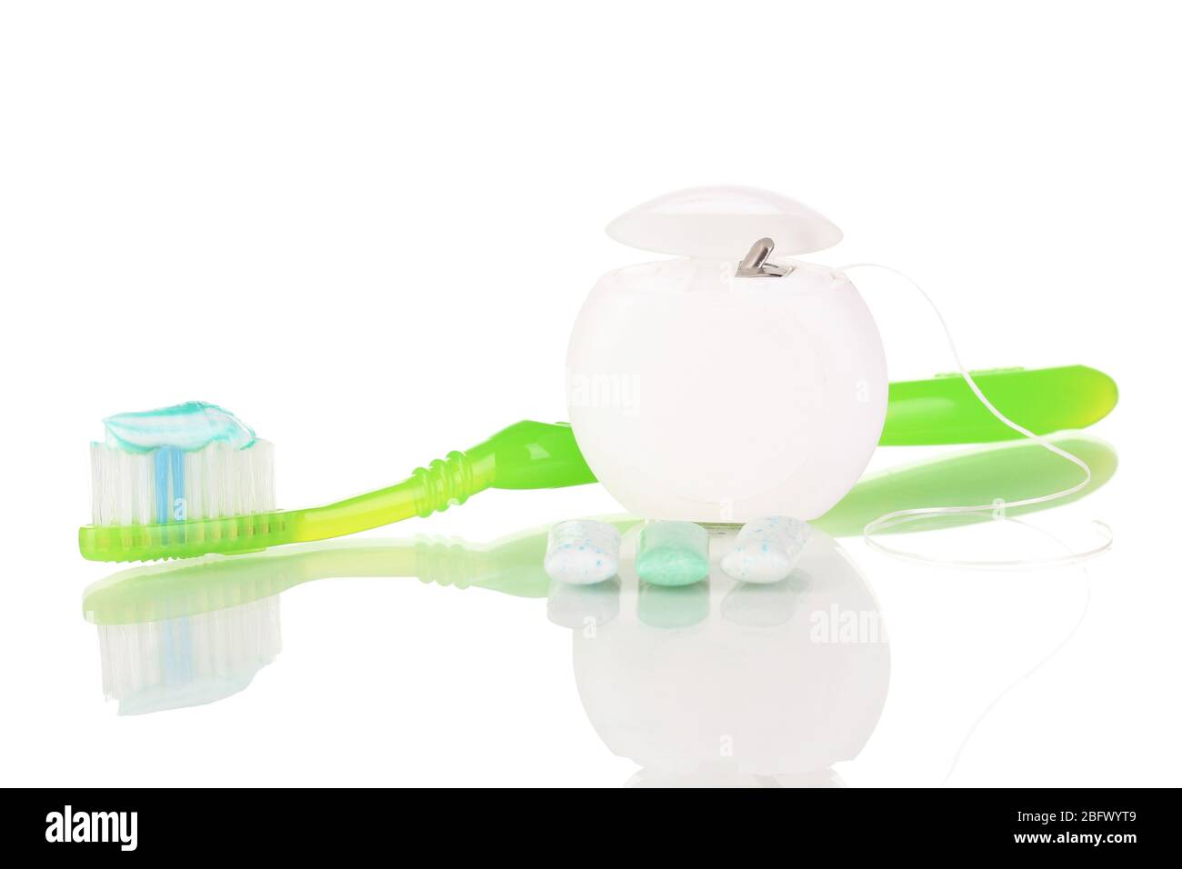 Toothbrush, chewing gum and dental floss isolated on white Stock Photo ...