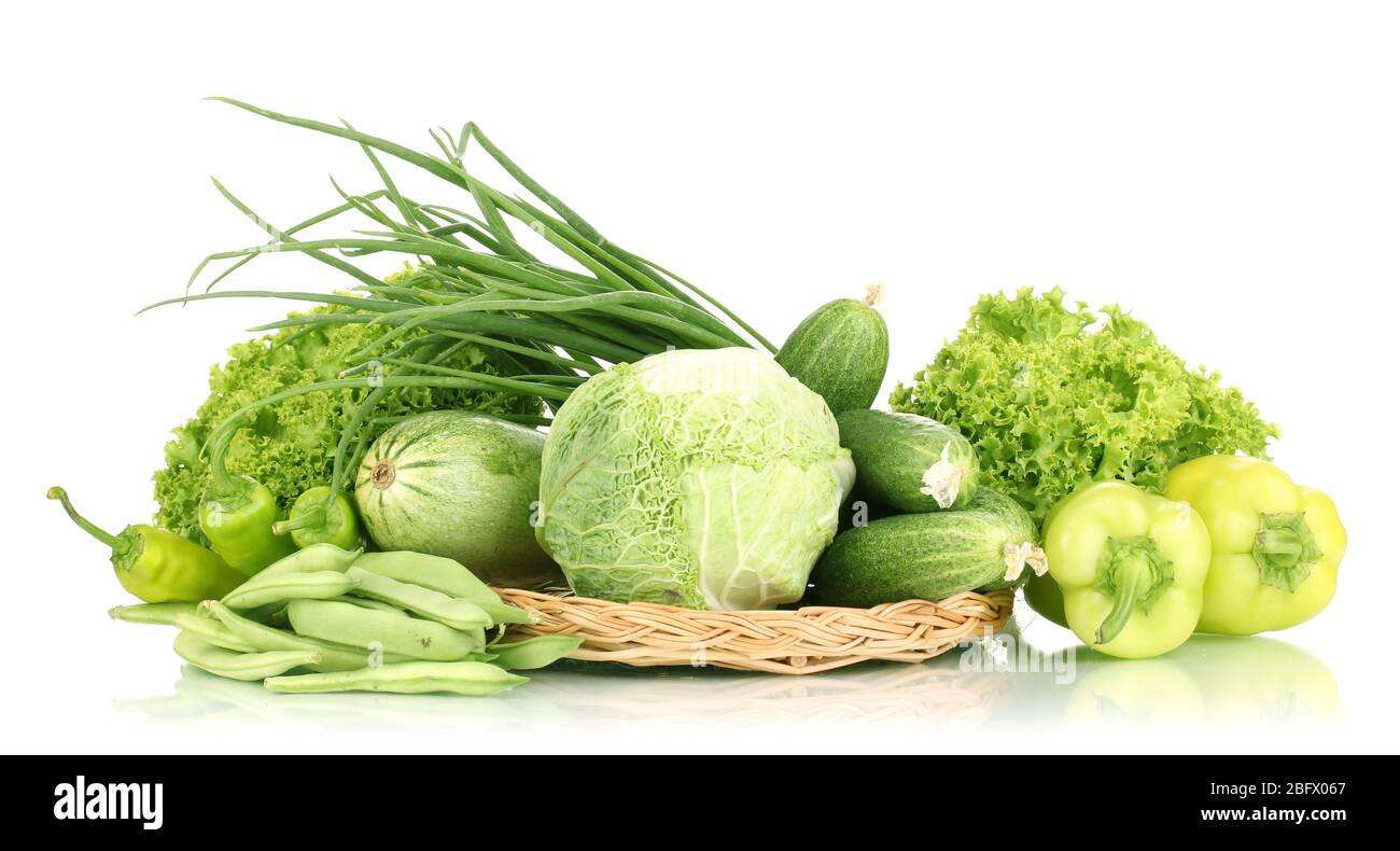 fresh green vegetables on wicker mat isolated on white Stock Photo - Alamy