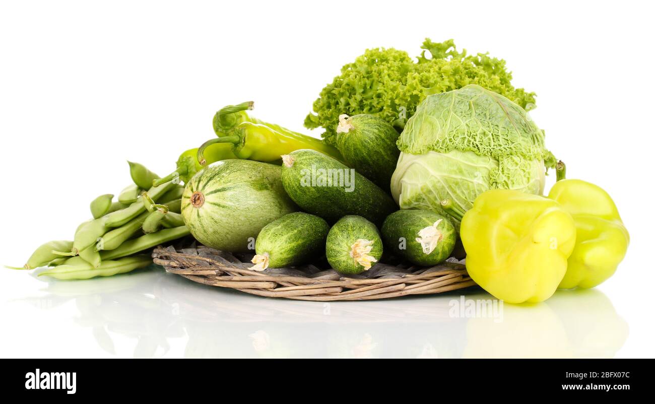fresh green vegetables on wicker mat isolated on white Stock Photo - Alamy