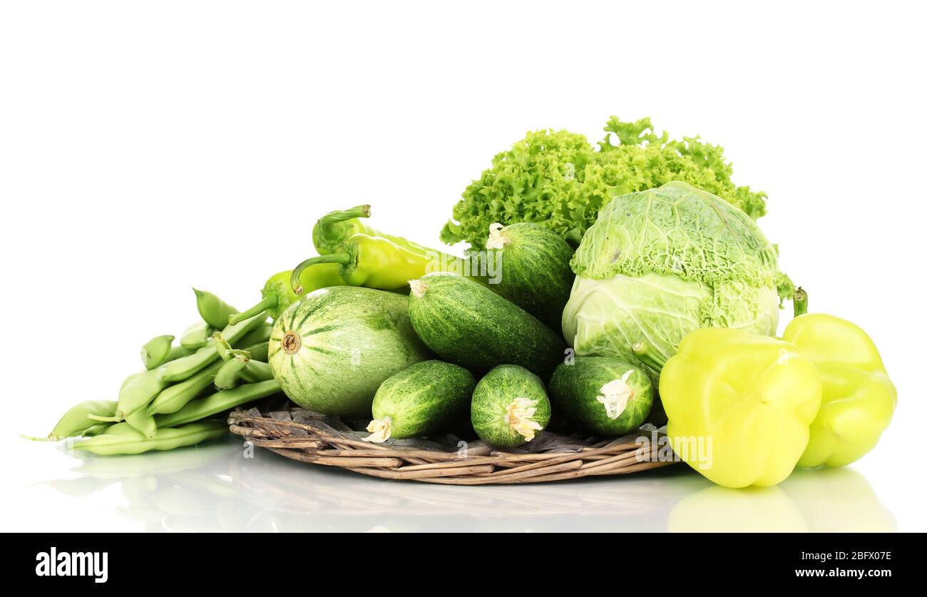 fresh green vegetables on wicker mat isolated on white Stock Photo - Alamy