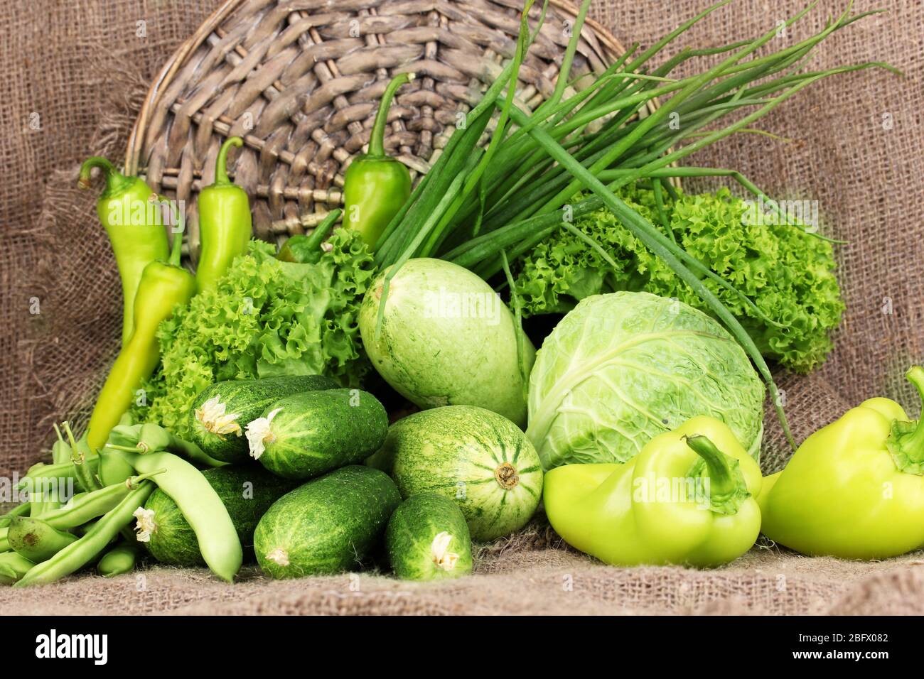 fresh green vegetables on sackcloth background Stock Photo - Alamy