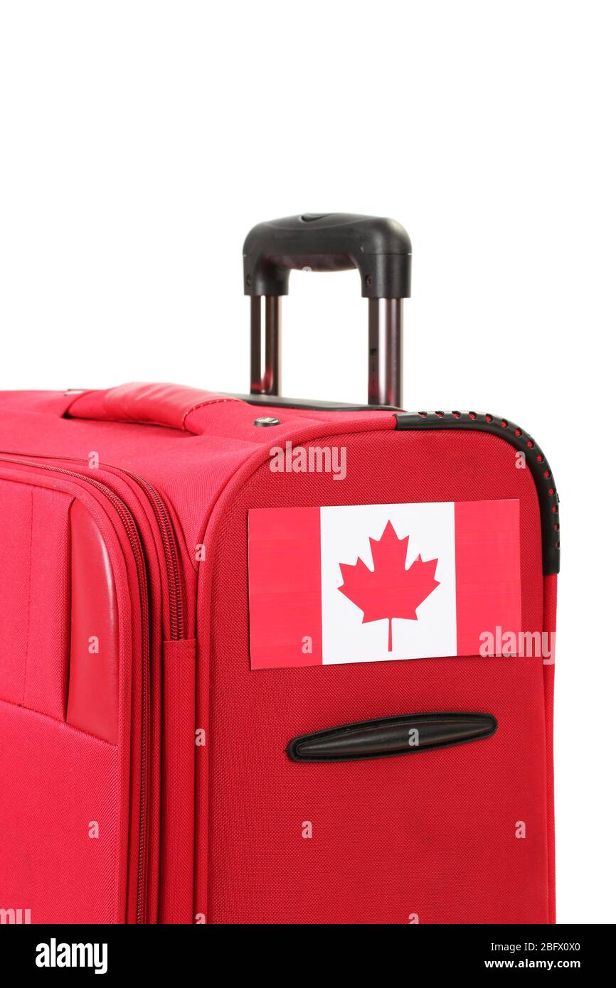 red suitcase with sticker with flag of Canada isolated on white Stock ...