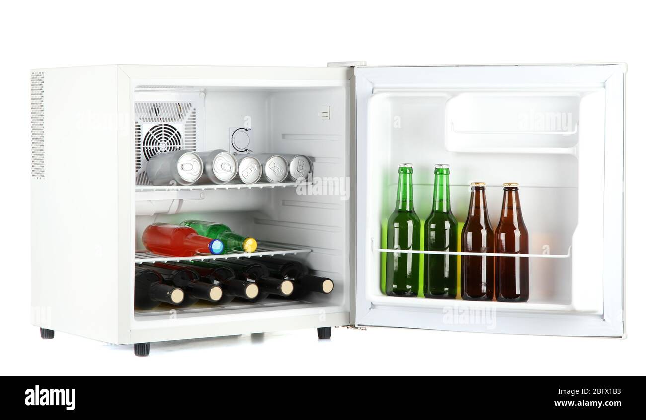 Mini fridge full of bottles of alcoholic beverages isolated on white ...