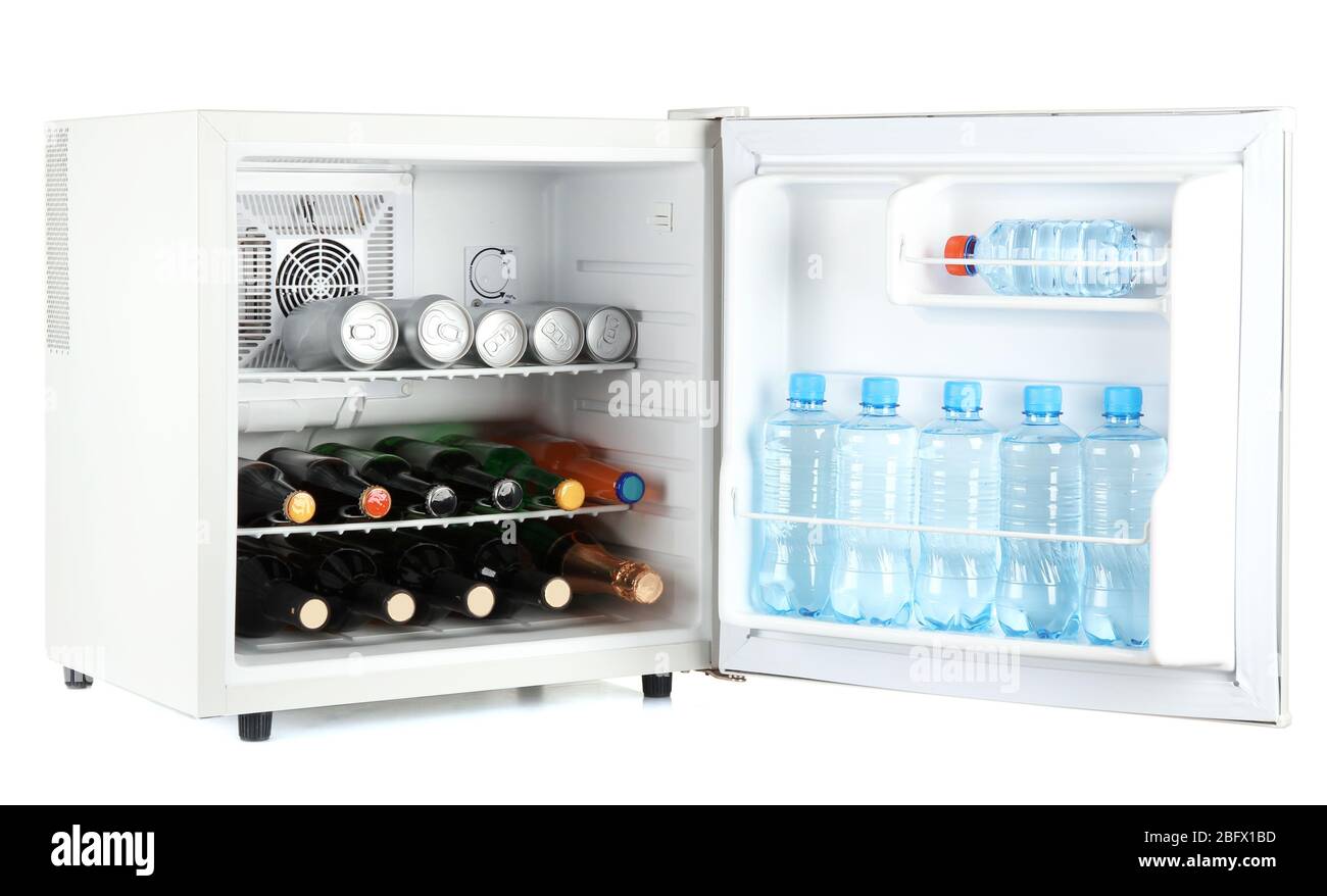 Mini fridge full of bottles of alcoholic beverages and water isolated ...