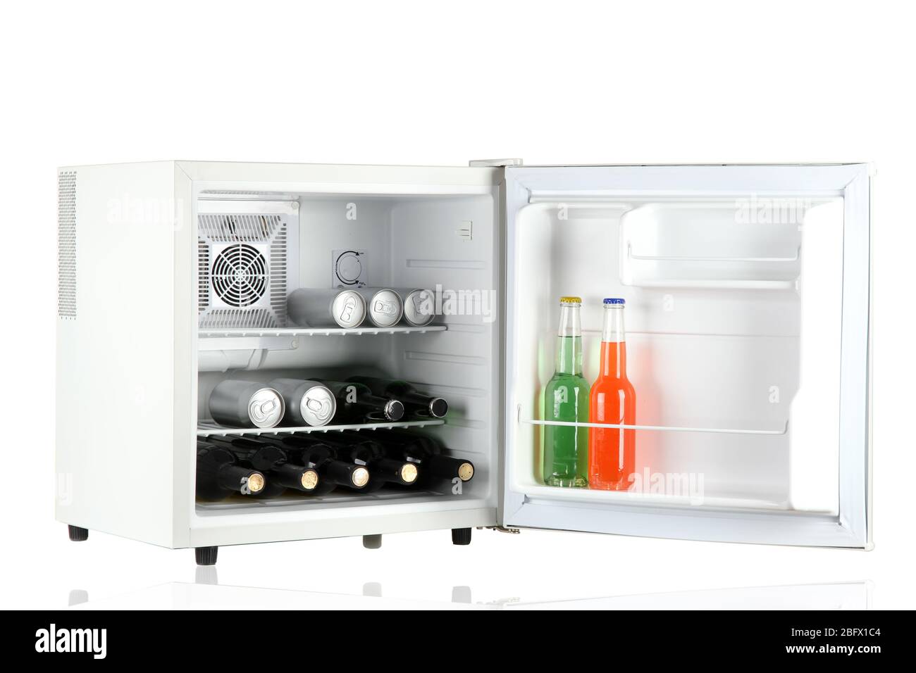 Mini fridge full of bottles of alcoholic beverages isolated on white ...