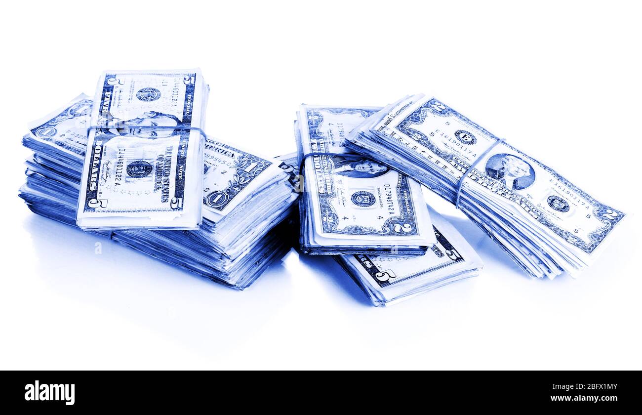 Stacks of dollars in blue light isolated on white Stock Photo - Alamy