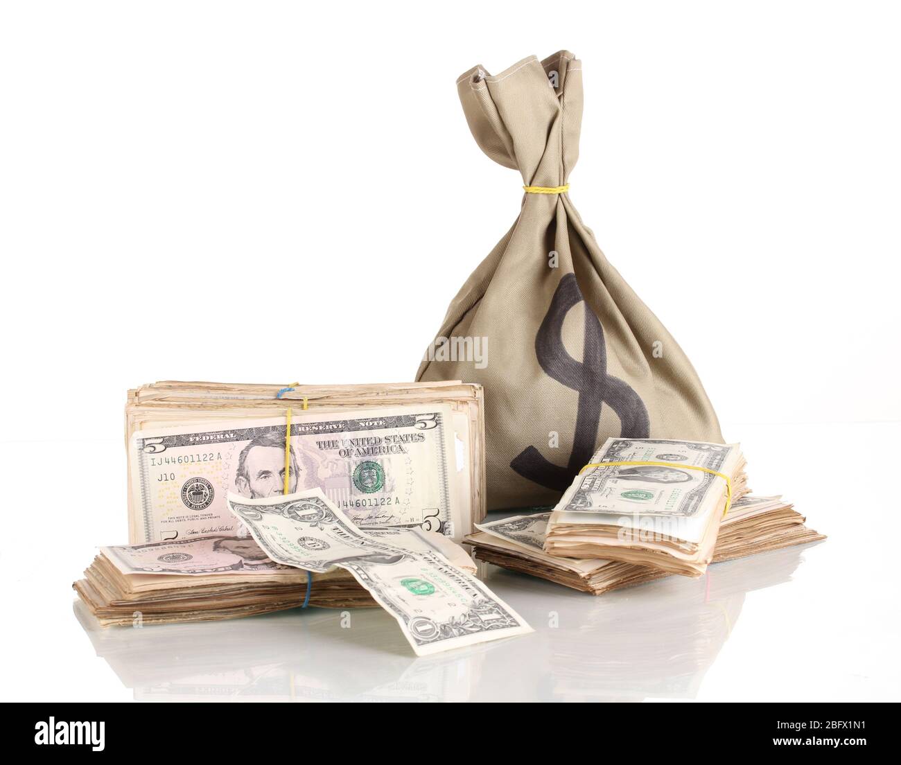 Bag with stacks of dollars isolated on white Stock Photo - Alamy