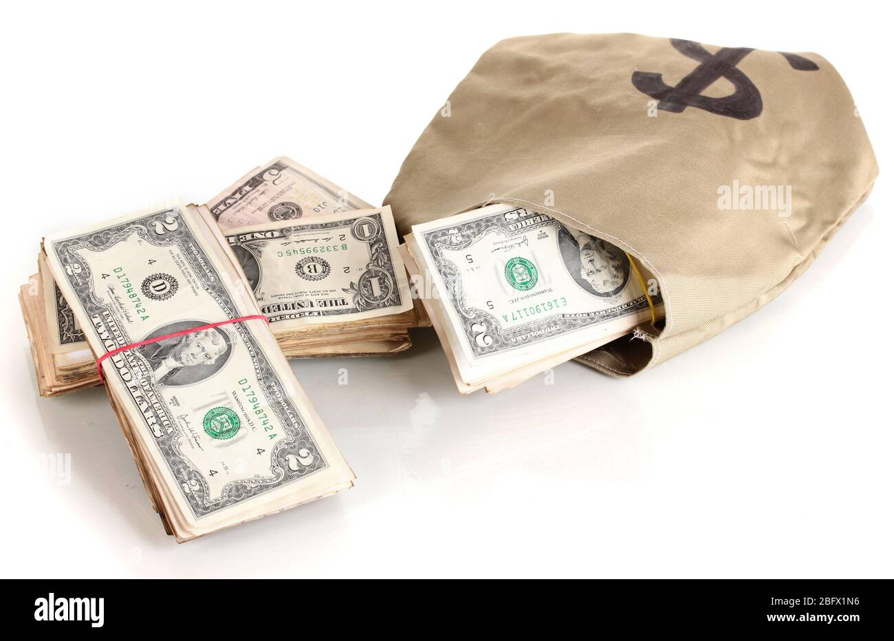 Bag with stacks of dollars isolated on white Stock Photo - Alamy