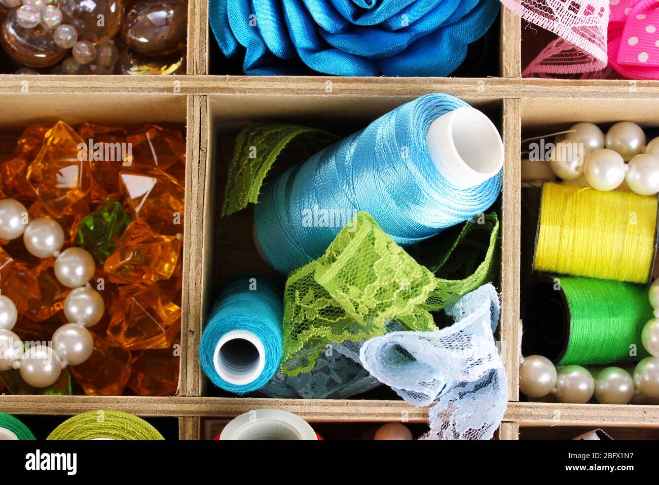 thread and material for handicrafts in box close-up Stock Photo - Alamy