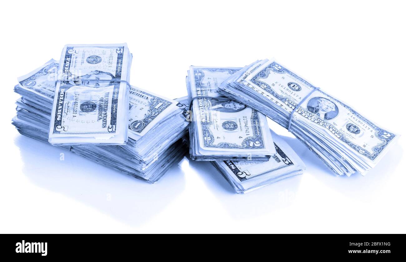 Stacks of dollars in blue light isolated on white Stock Photo - Alamy