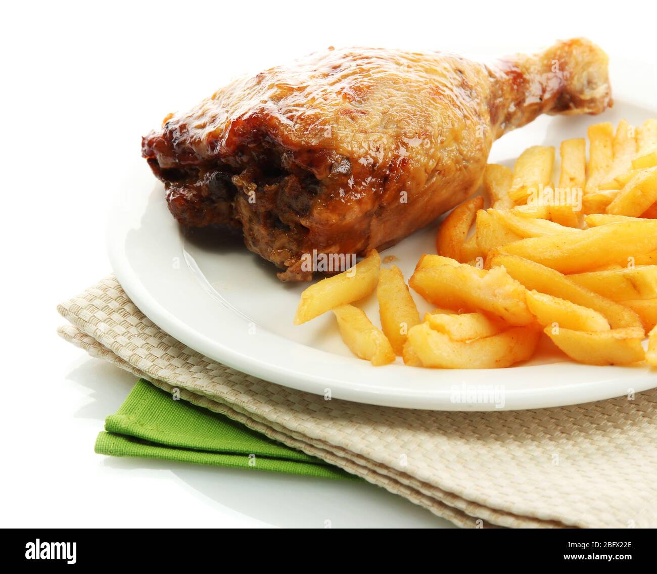 Roast chicken with french fries on plate, isolated on white Stock Photo ...