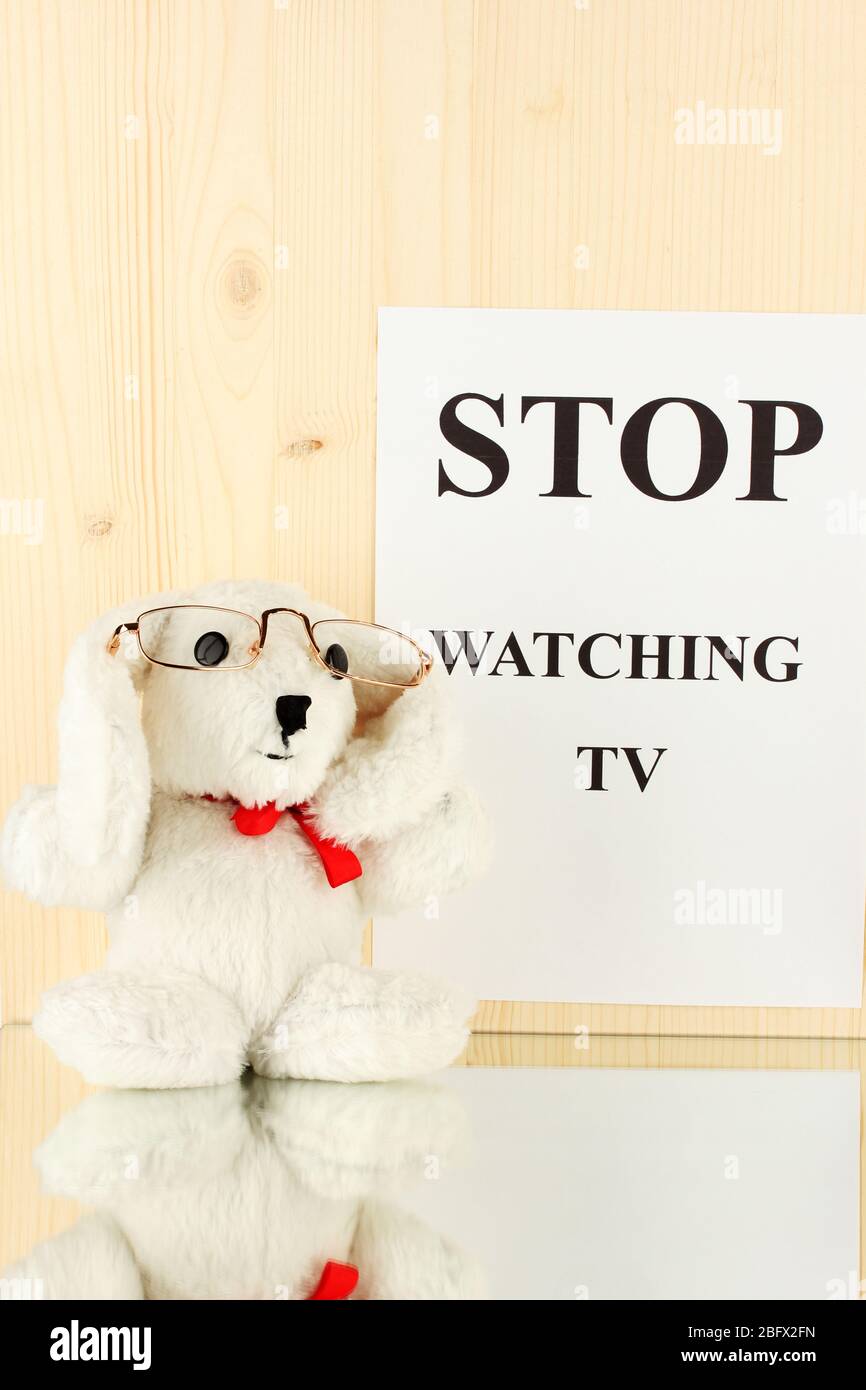 Eyesight test chart with glasses and with toy on wooden background ...