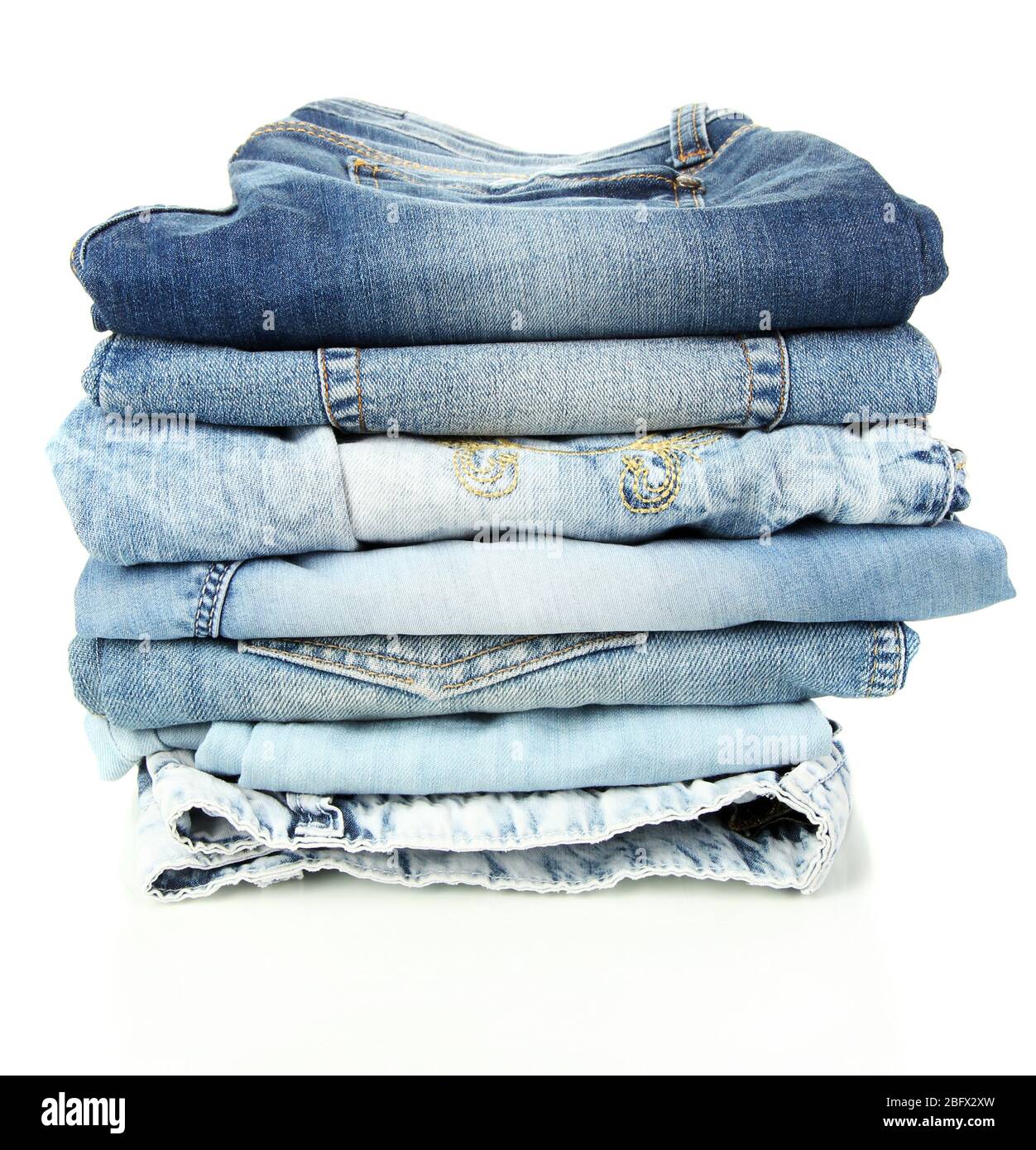 Lot of different blue jeans isolated on white Stock Photo - Alamy
