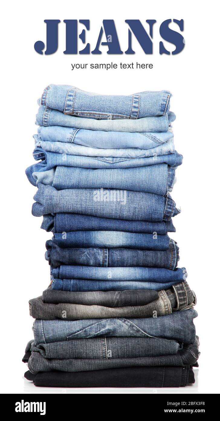 Many jeans stacked in a pile isolated on white Stock Photo - Alamy