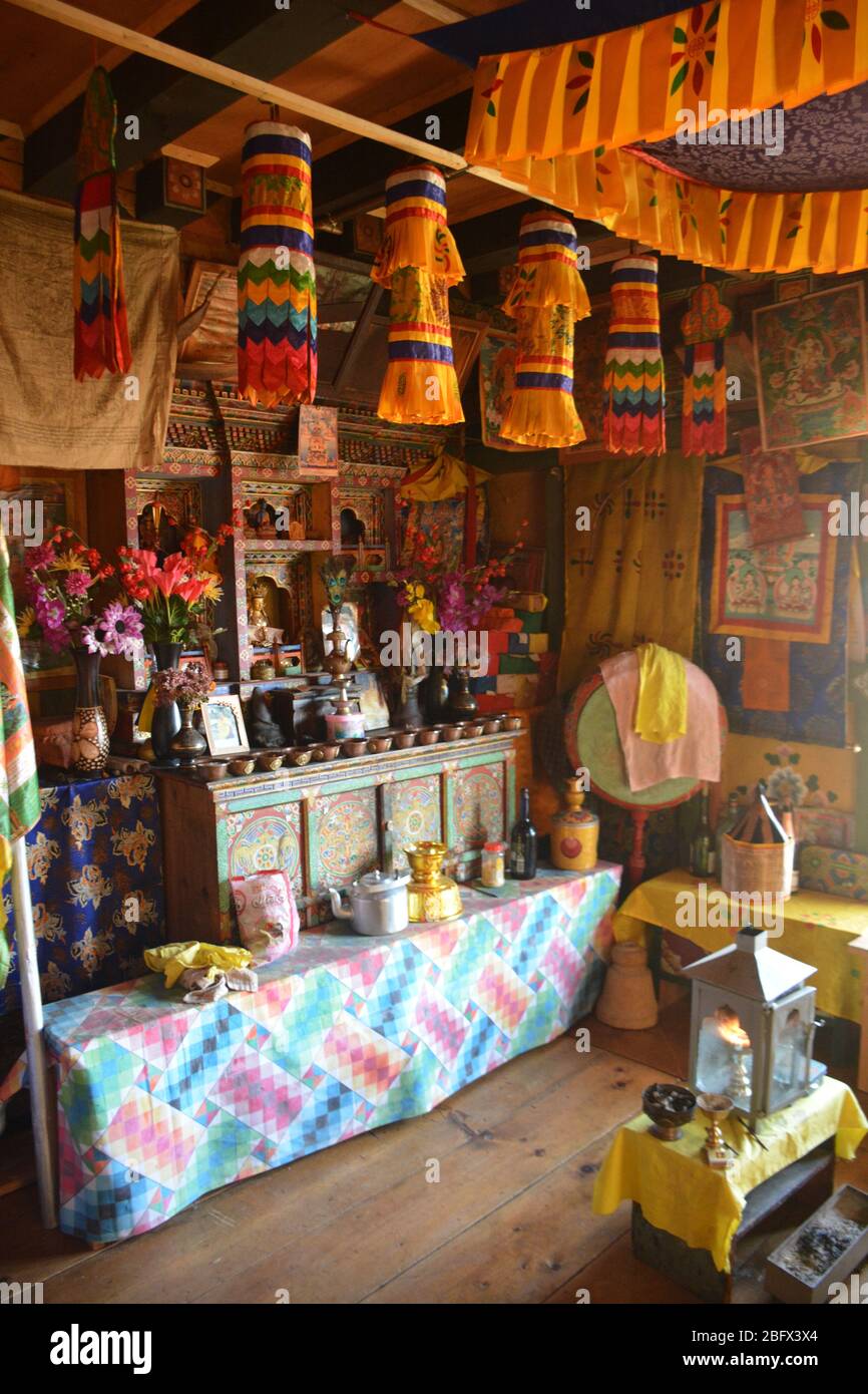 A shrine room at a traditional Bhutanese farmhouse near Bumthang ...