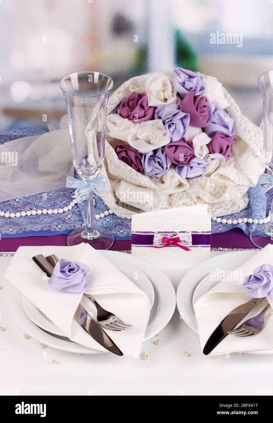 Serving fabulous wedding table in purple color of the restaurant ...