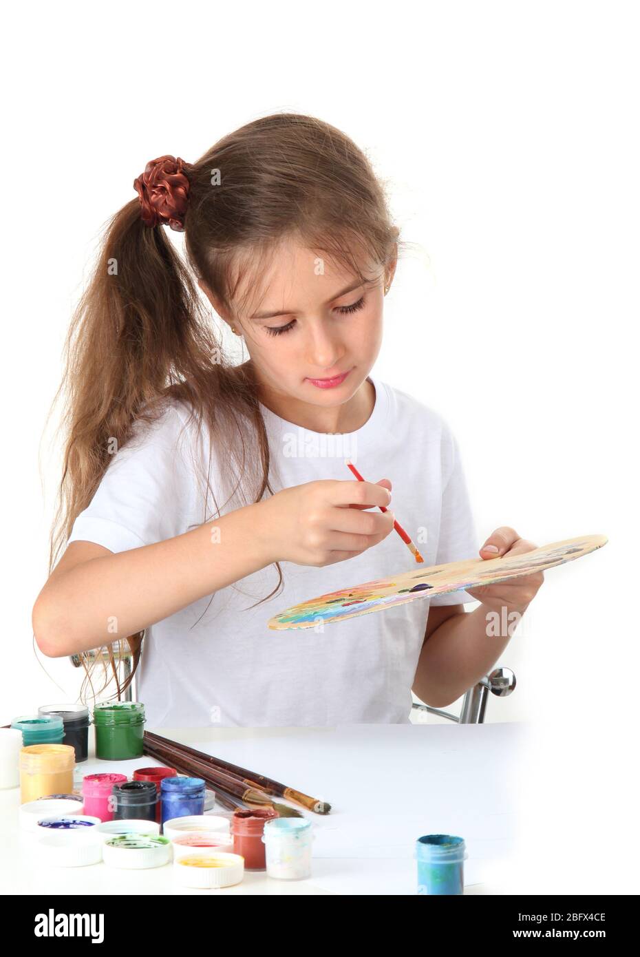 Cute little girl painting a picture, isolated on white Stock Photo - Alamy