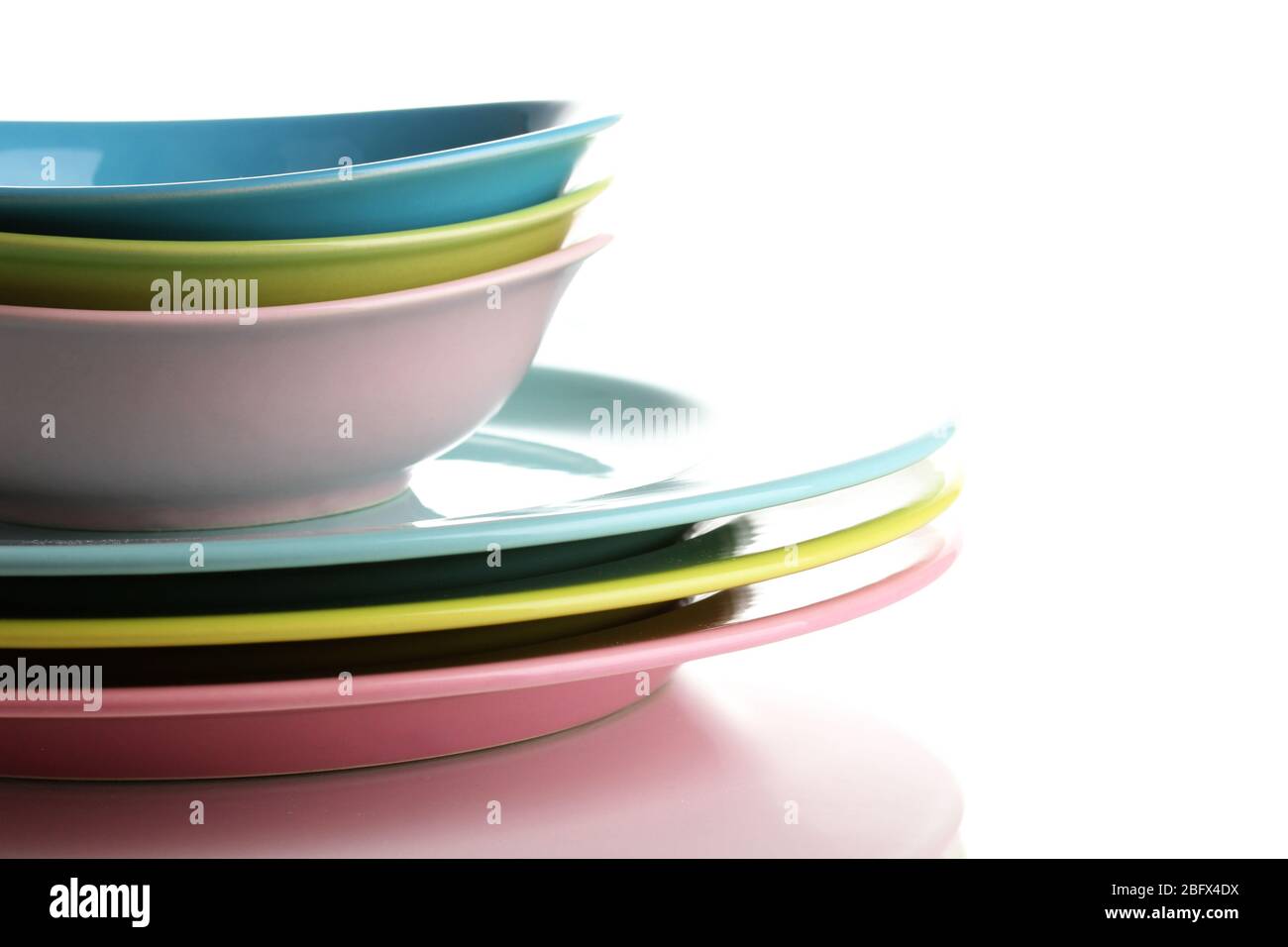 Colorful plates close-up isolated on white Stock Photo - Alamy