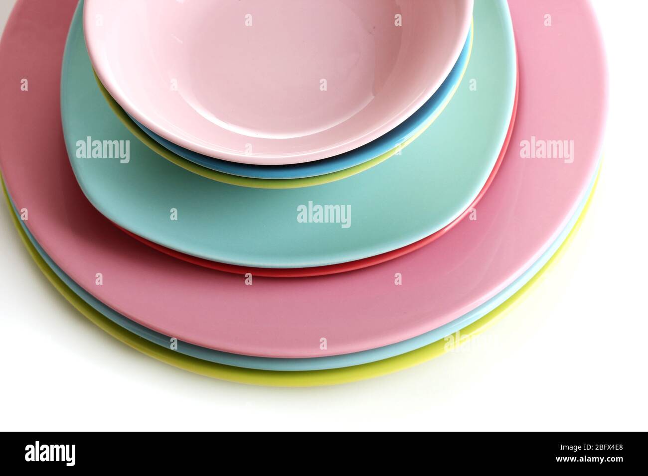 Colorful plates close-up isolated on white Stock Photo - Alamy