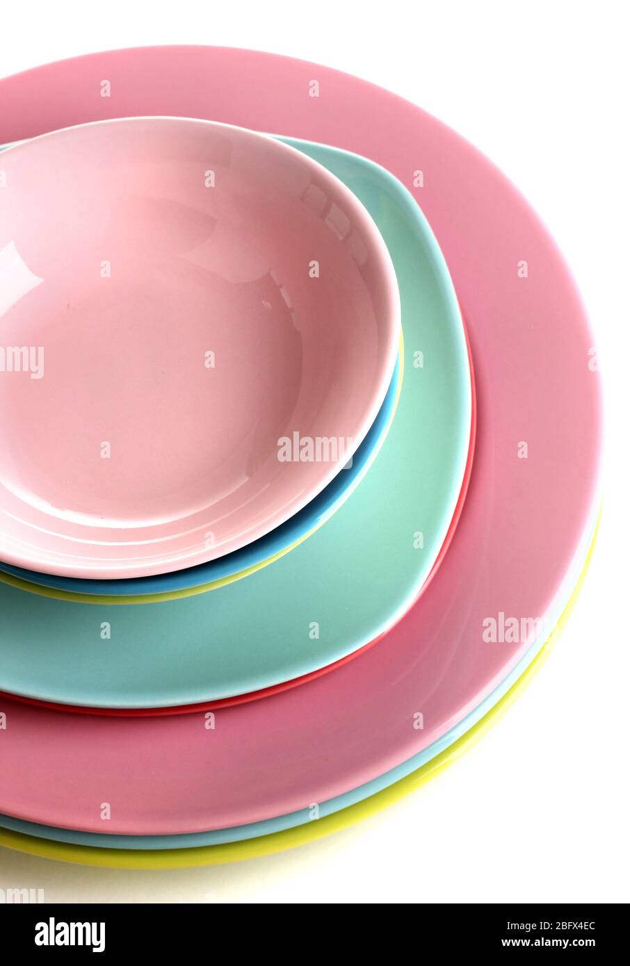 Colorful plates close-up isolated on white Stock Photo - Alamy