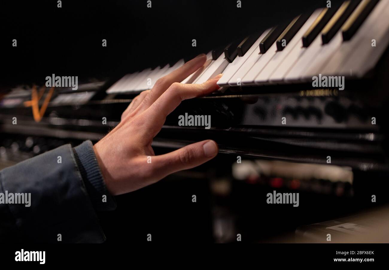 Hand close-up of person playing keyboard Stock Photo - Alamy