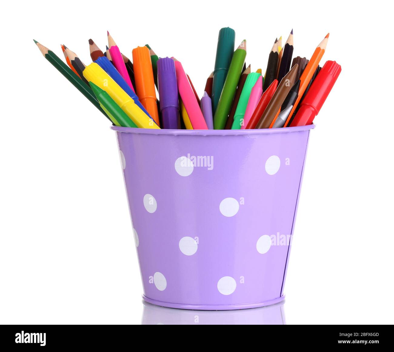 Colorful pencils and felt-tip pens in purple pail isolated on white ...