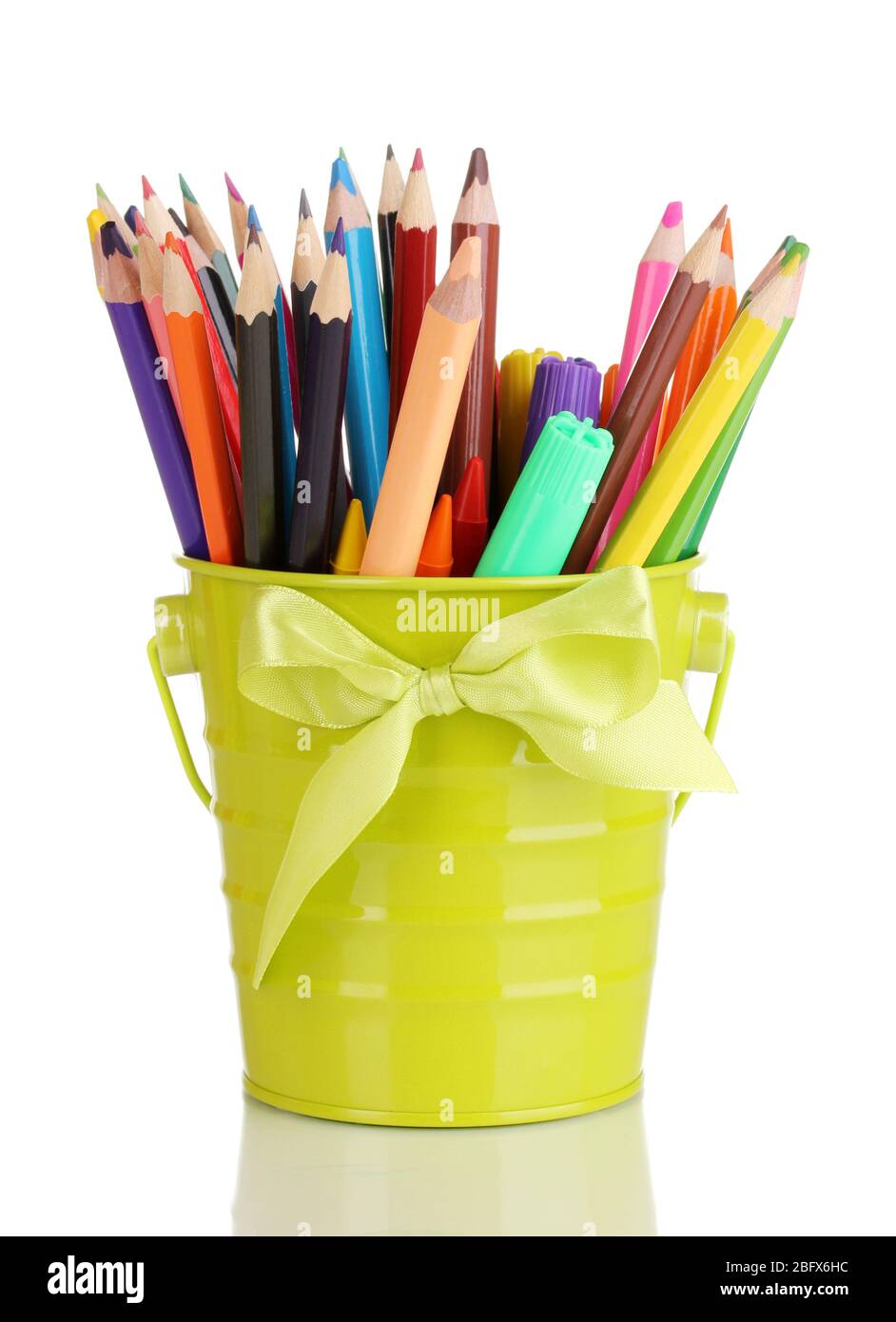 Colorful pencils and felt-tip pens in green pail isolated on white ...