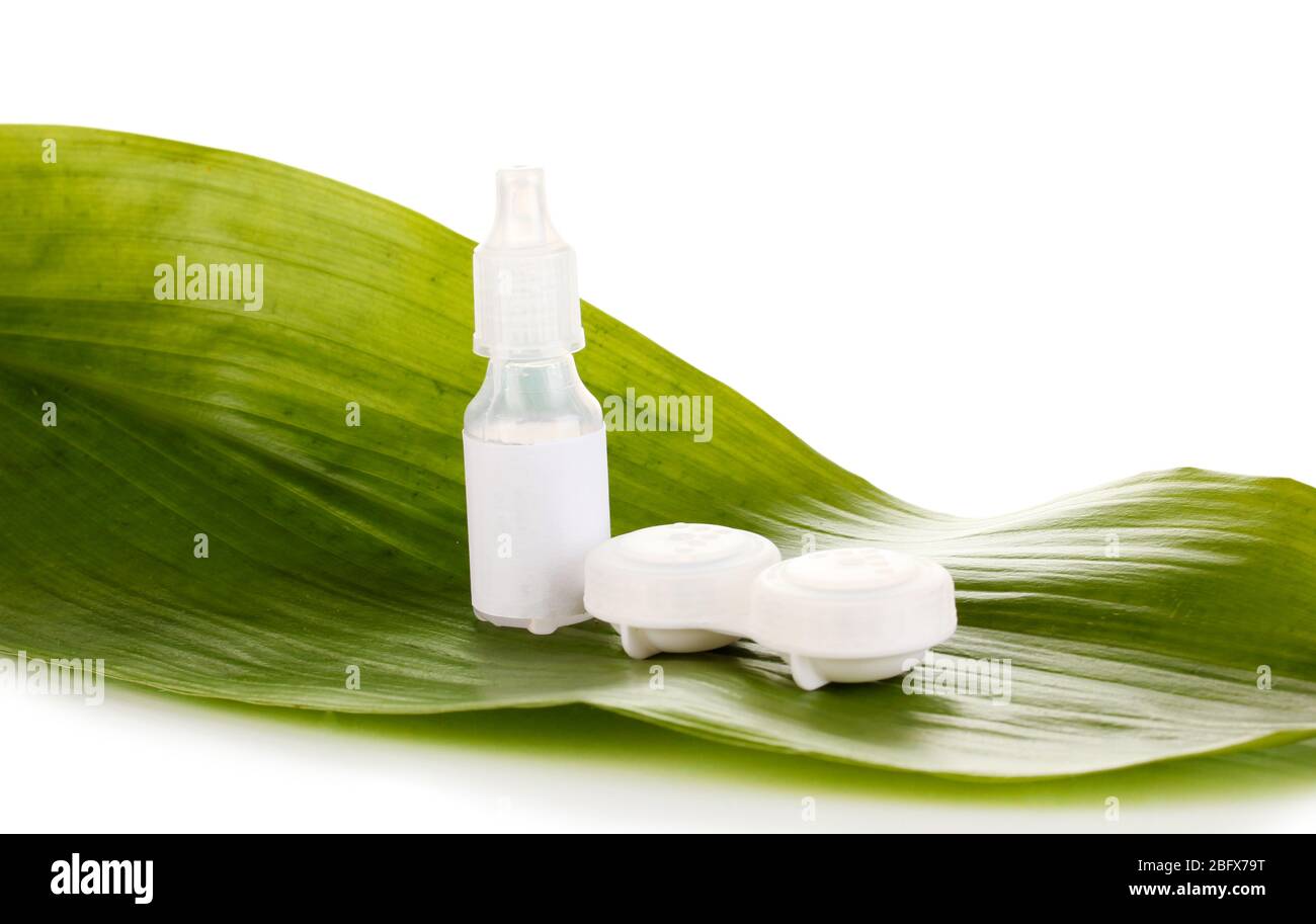 Eye drops and lenses on leaf isolated on white Stock Photo - Alamy