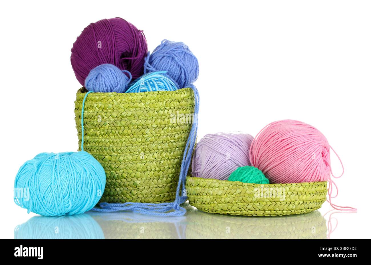Colorful yarn for knitting in green basket isolated on white Stock ...