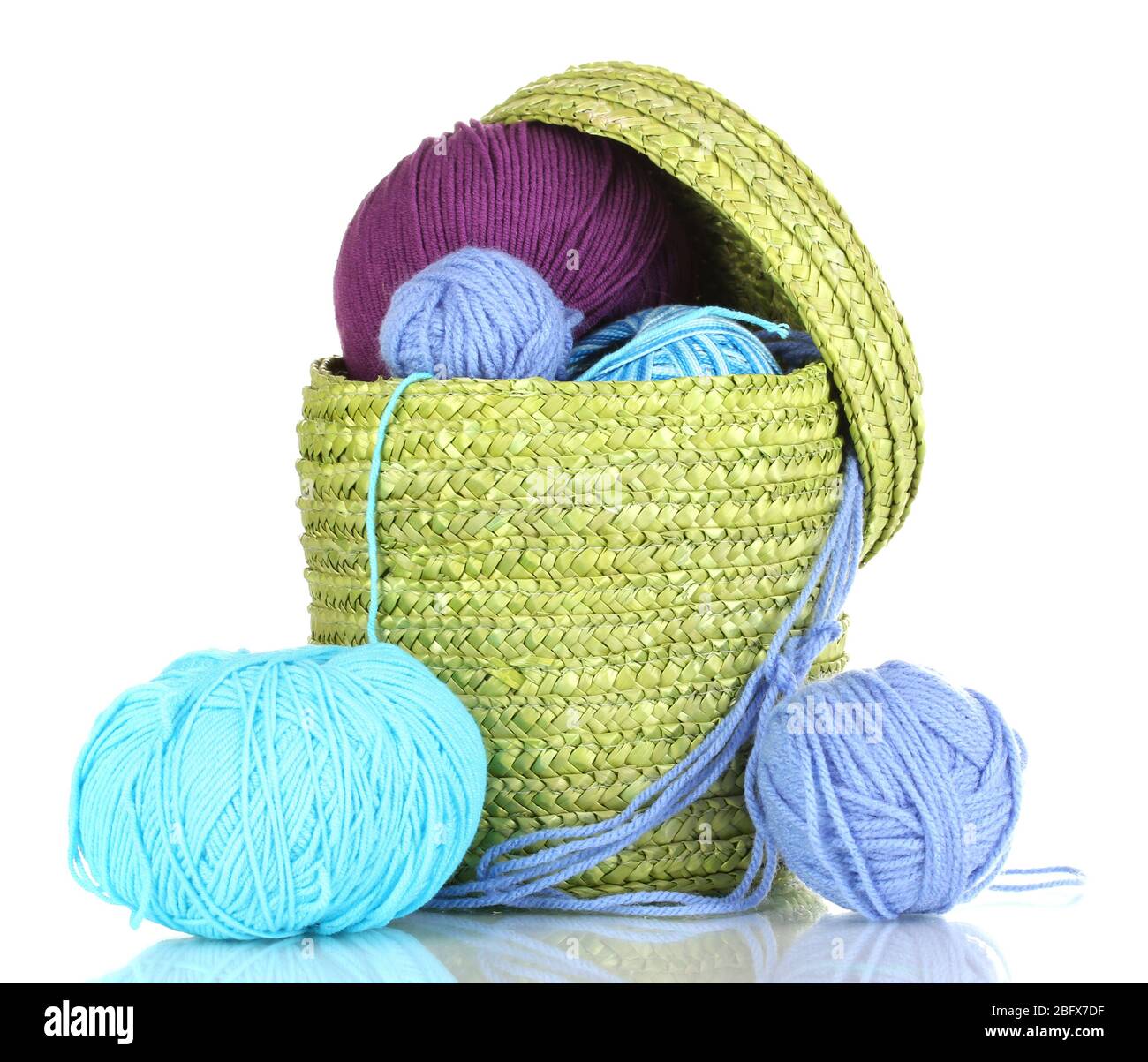 Colorful yarn for knitting in green basket isolated on white Stock ...