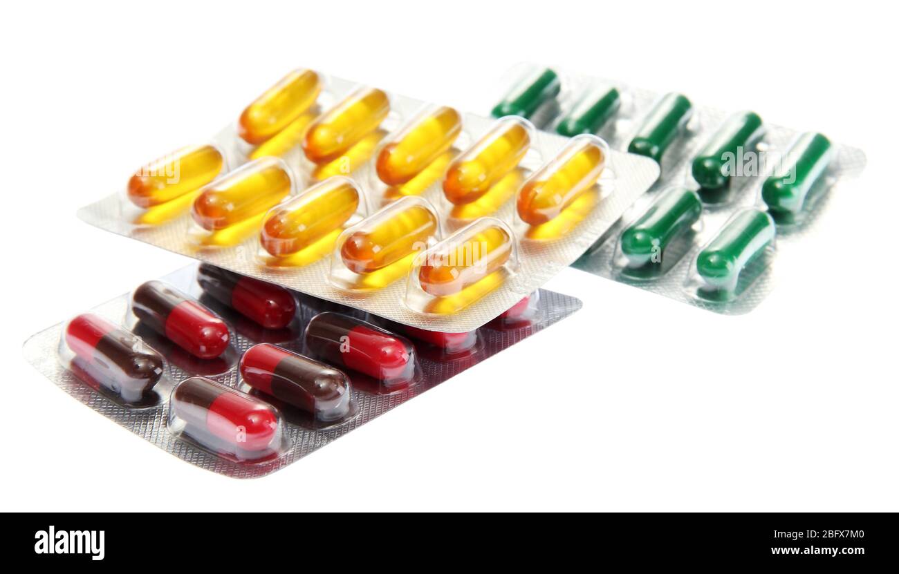 Capsules packed in blisters, isolated on white Stock Photo - Alamy