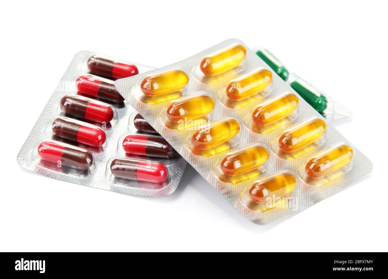 Capsules packed in blisters, isolated on white Stock Photo - Alamy