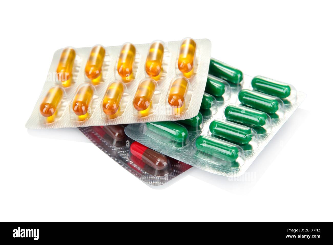 Capsules packed in blisters, isolated on white Stock Photo - Alamy