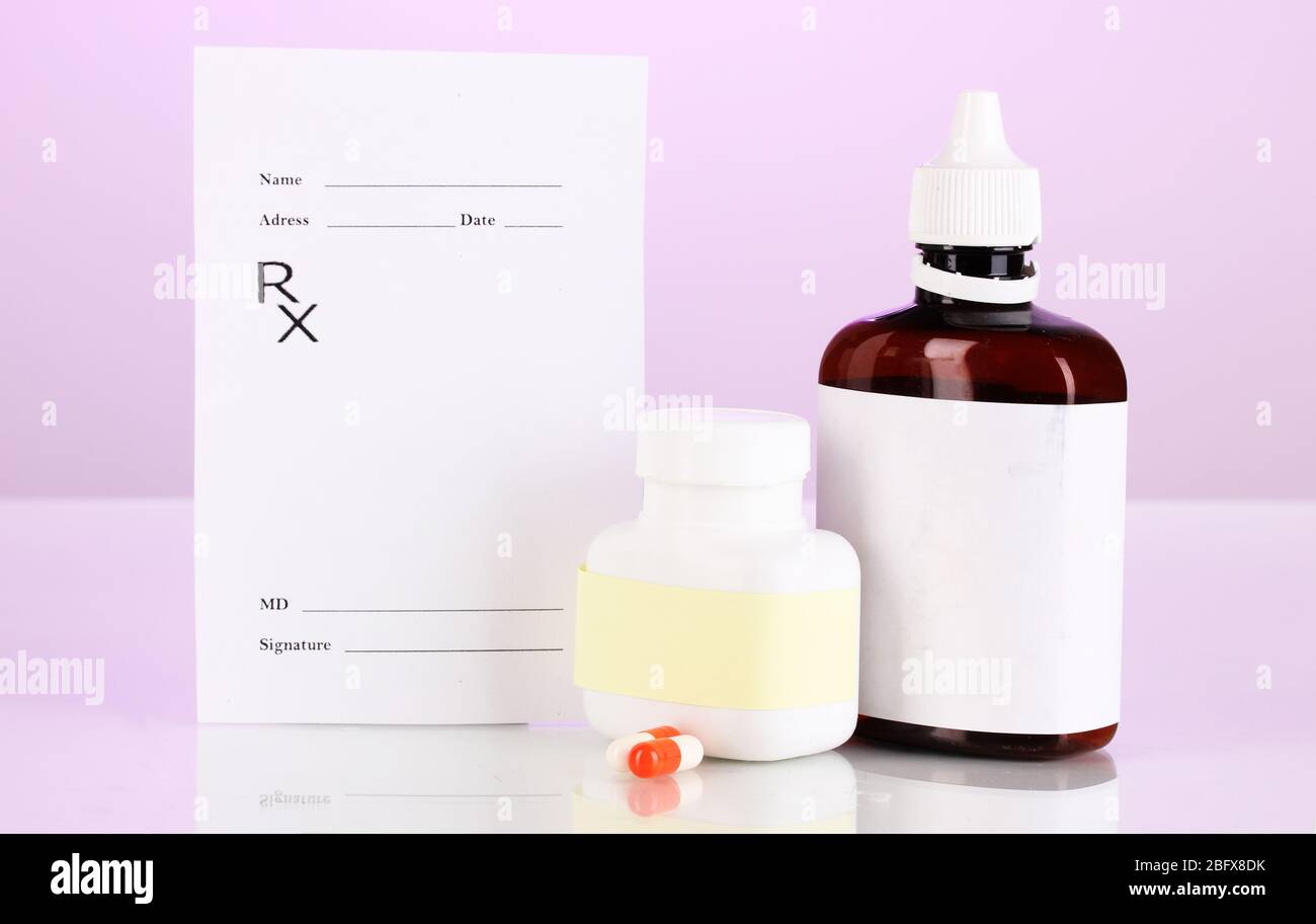 Pharmacist prescription with drops and pills isolated on purple Stock ...