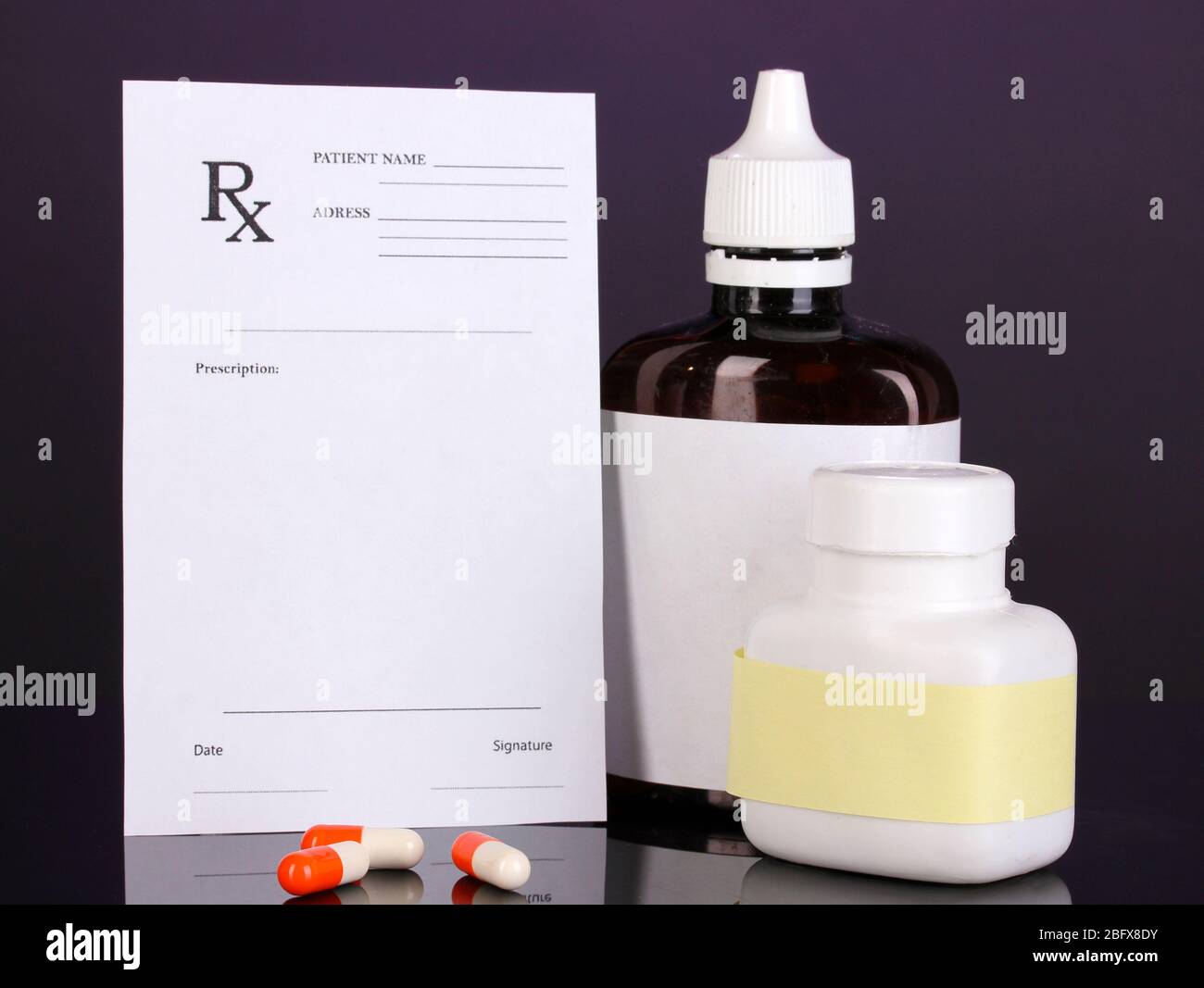 Pharmacist prescription with drops and pills isolated on purple Stock ...