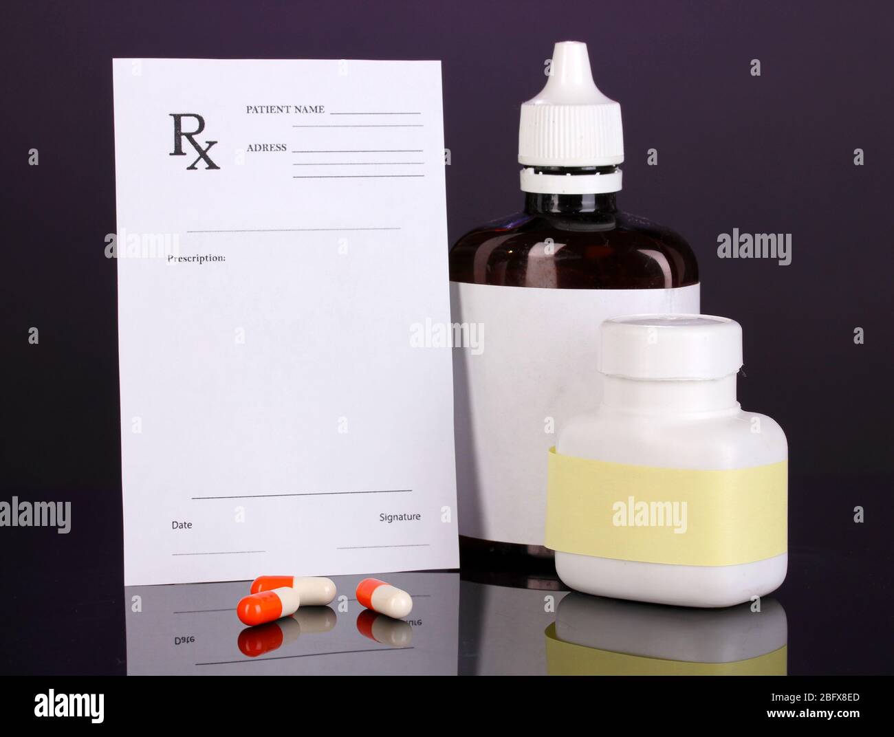 Pharmacist prescription with drops and pills isolated on purple Stock ...