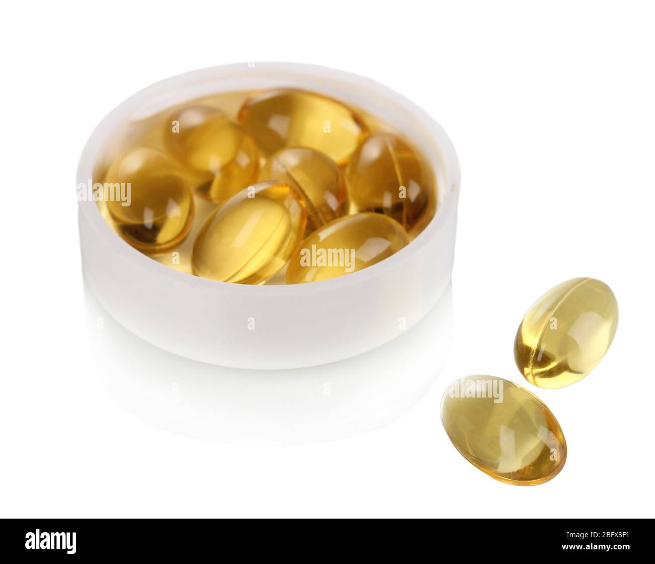 Dispenser for tablets with pills isolated on white Stock Photo - Alamy