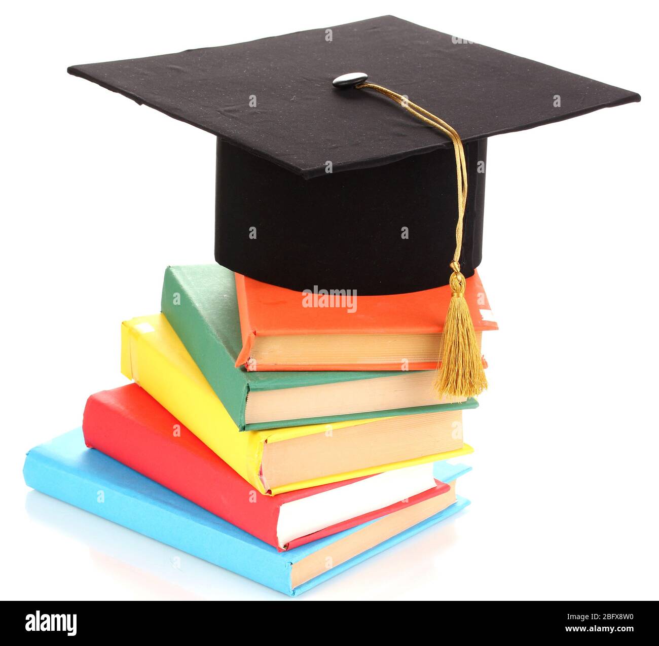 Grad hat with books isolated on white Stock Photo - Alamy