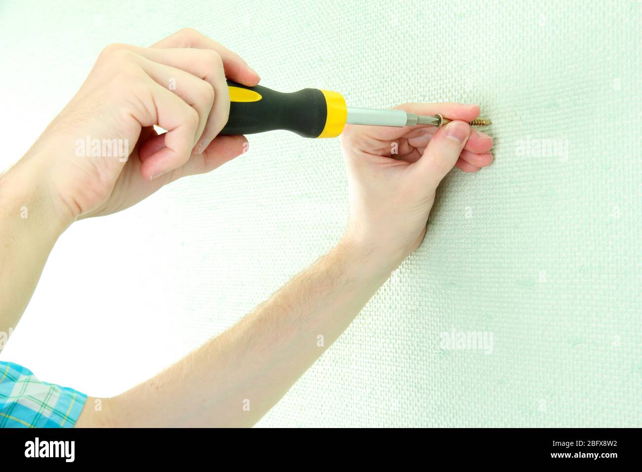 man hands with screwdriver and screw Stock Photo - Alamy