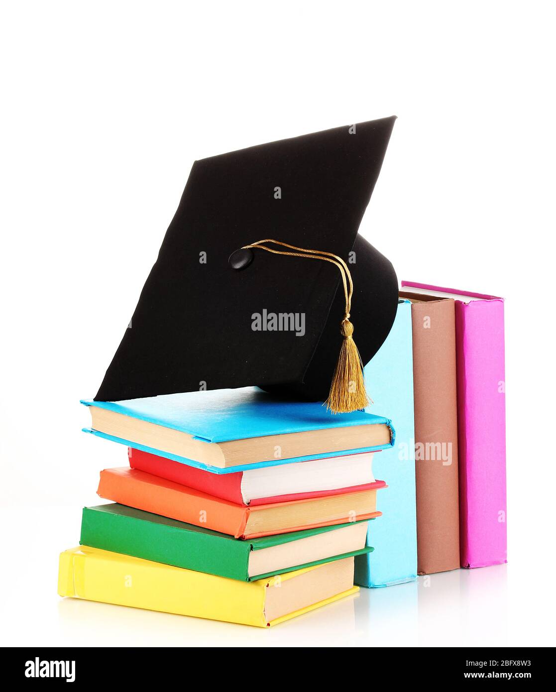Grad hat with books isolated on white Stock Photo - Alamy