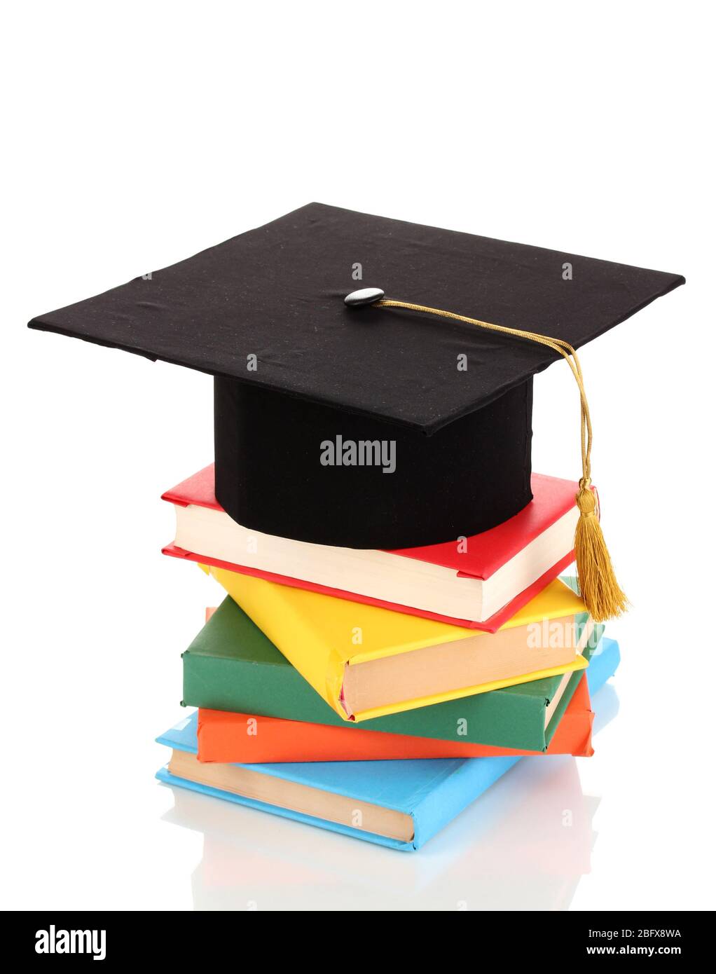 Grad hat with books isolated on white Stock Photo - Alamy