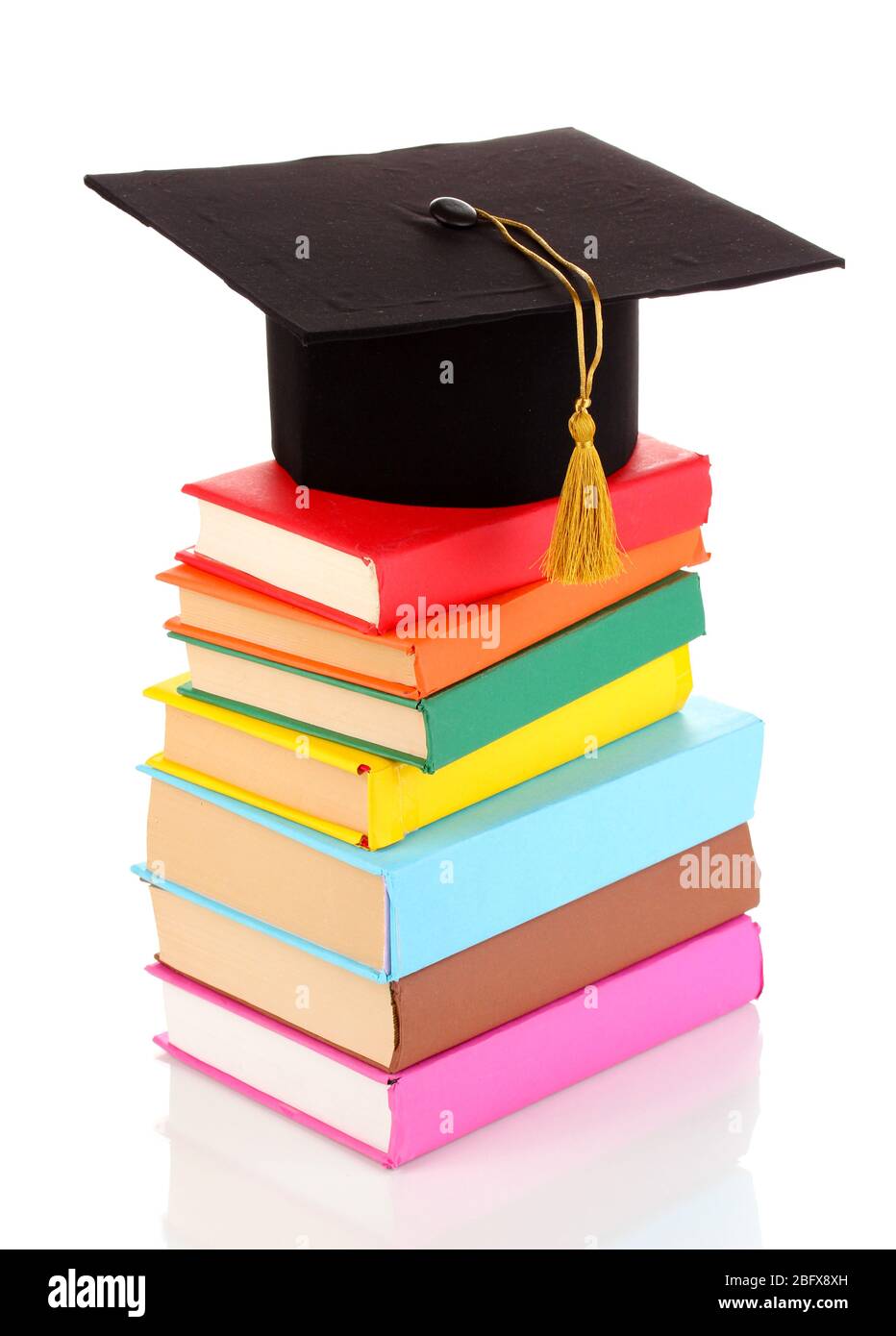 Grad hat with books isolated on white Stock Photo - Alamy