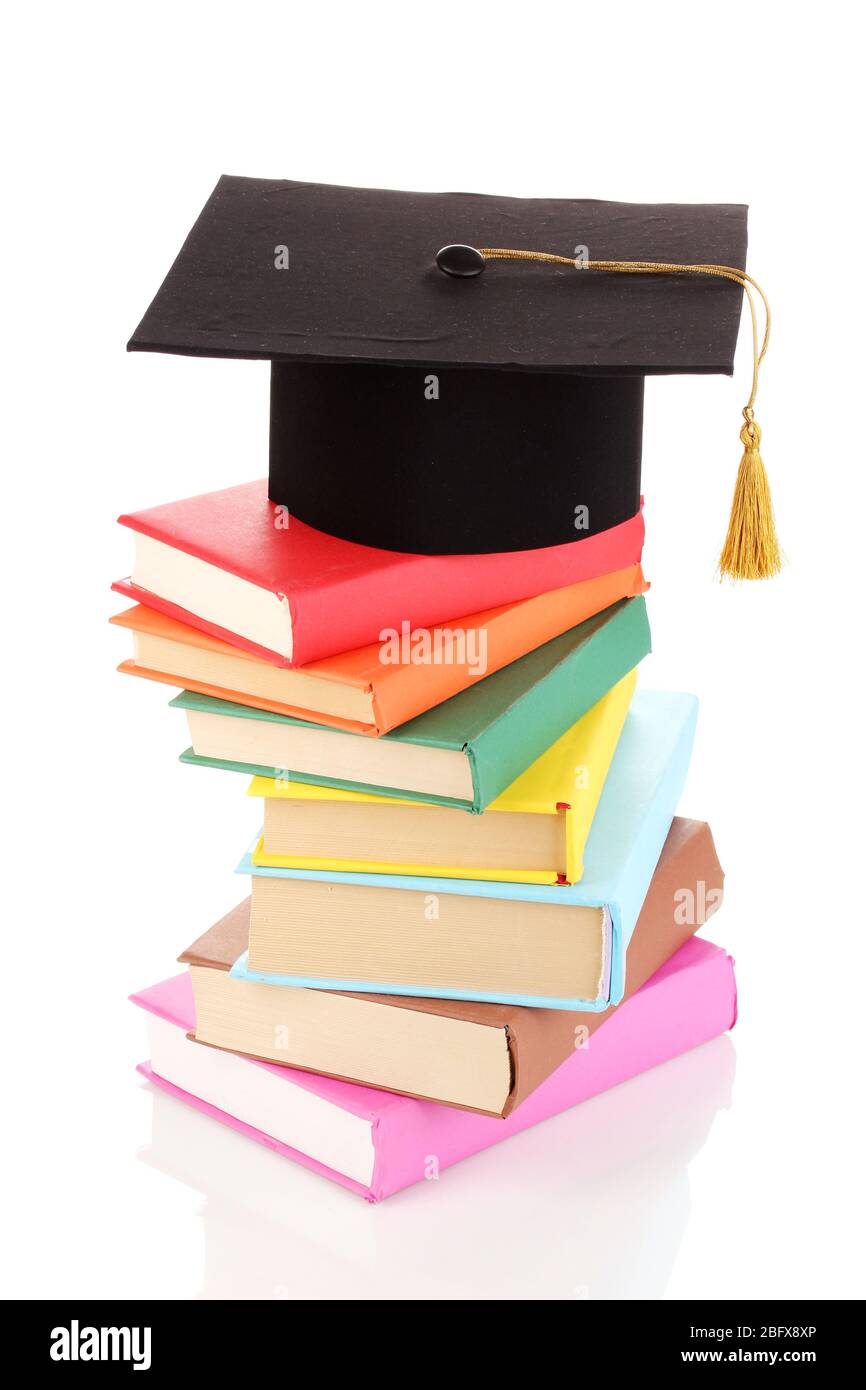 Grad hat with books isolated on white Stock Photo - Alamy