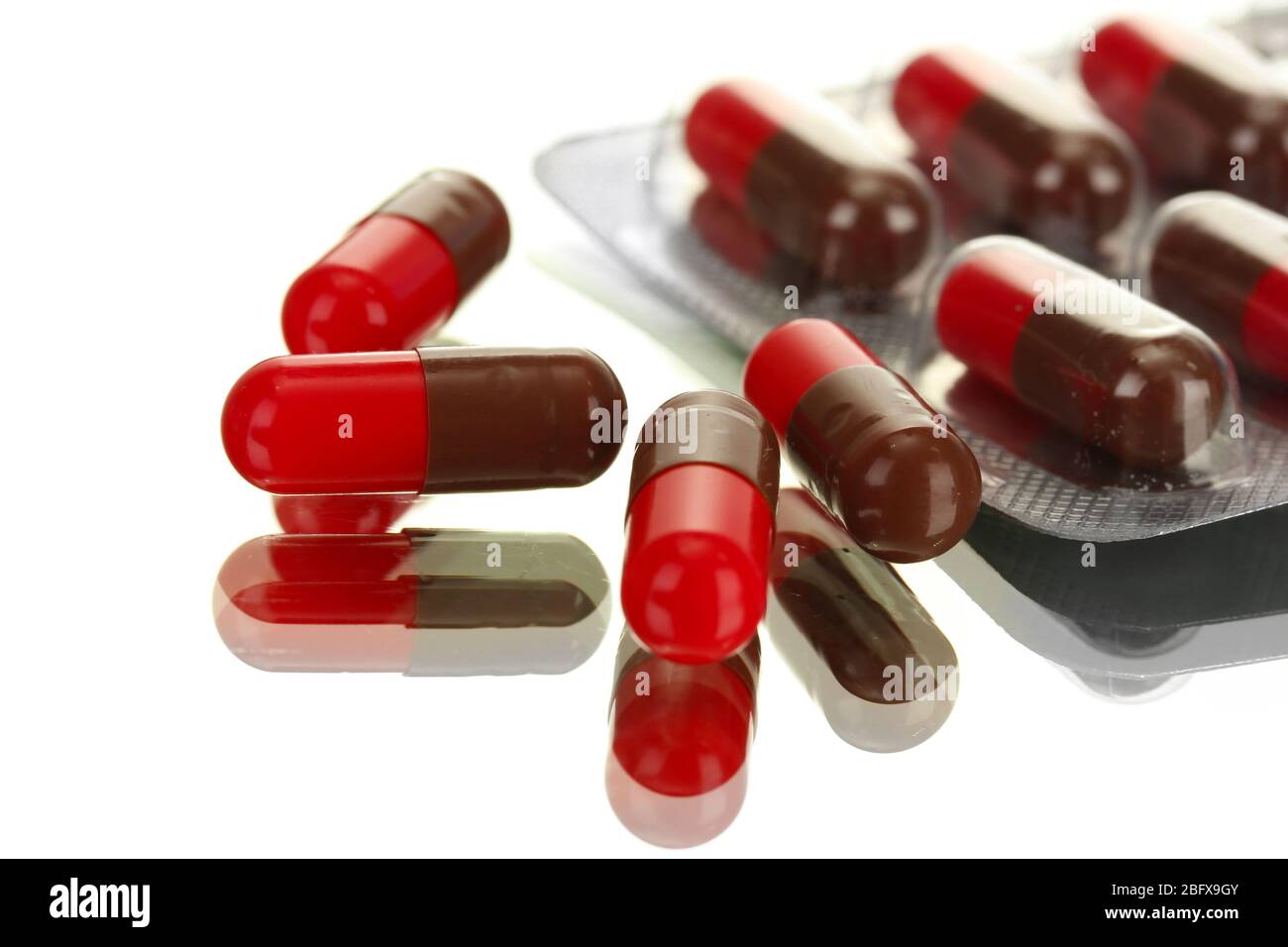 Capsules packed in blisters, isolated on white Stock Photo - Alamy