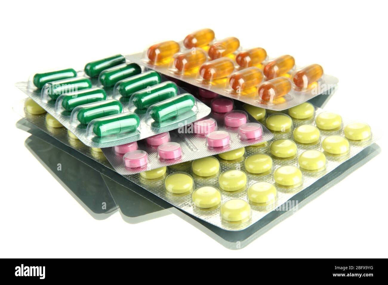 Capsules and pills packed in blisters, isolated on white Stock Photo ...