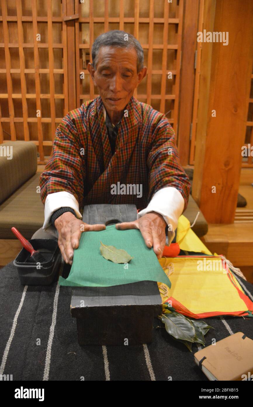 A demonstration of prayer flag printing at Aman Paro, Bhutan Stock ...