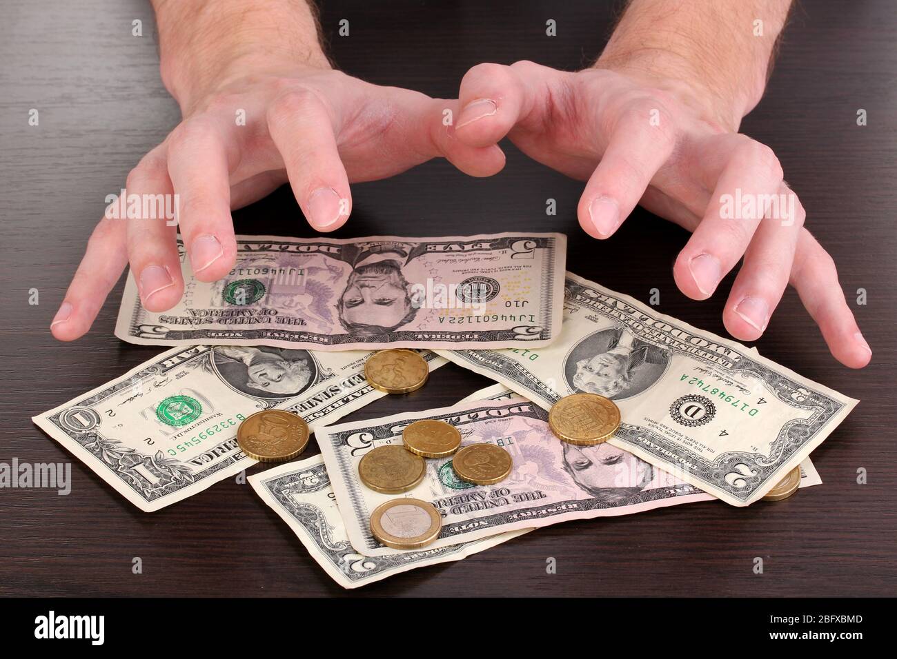 Counting dollars on white table hi-res stock photography and images - Alamy