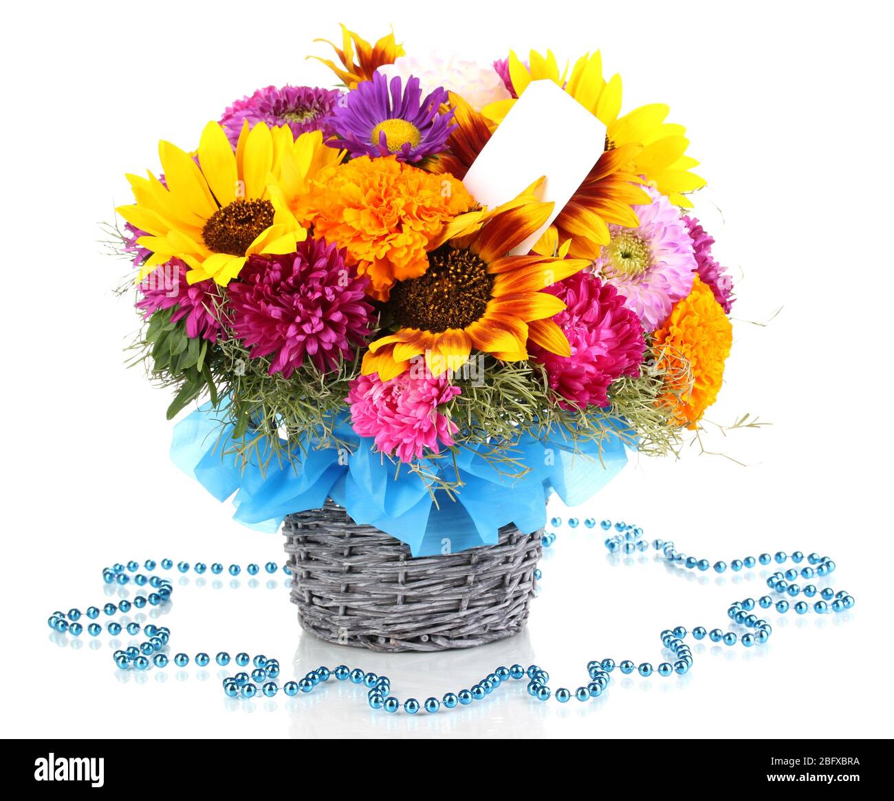 Beautiful bouquet of bright flowers with paper note isolated on white ...