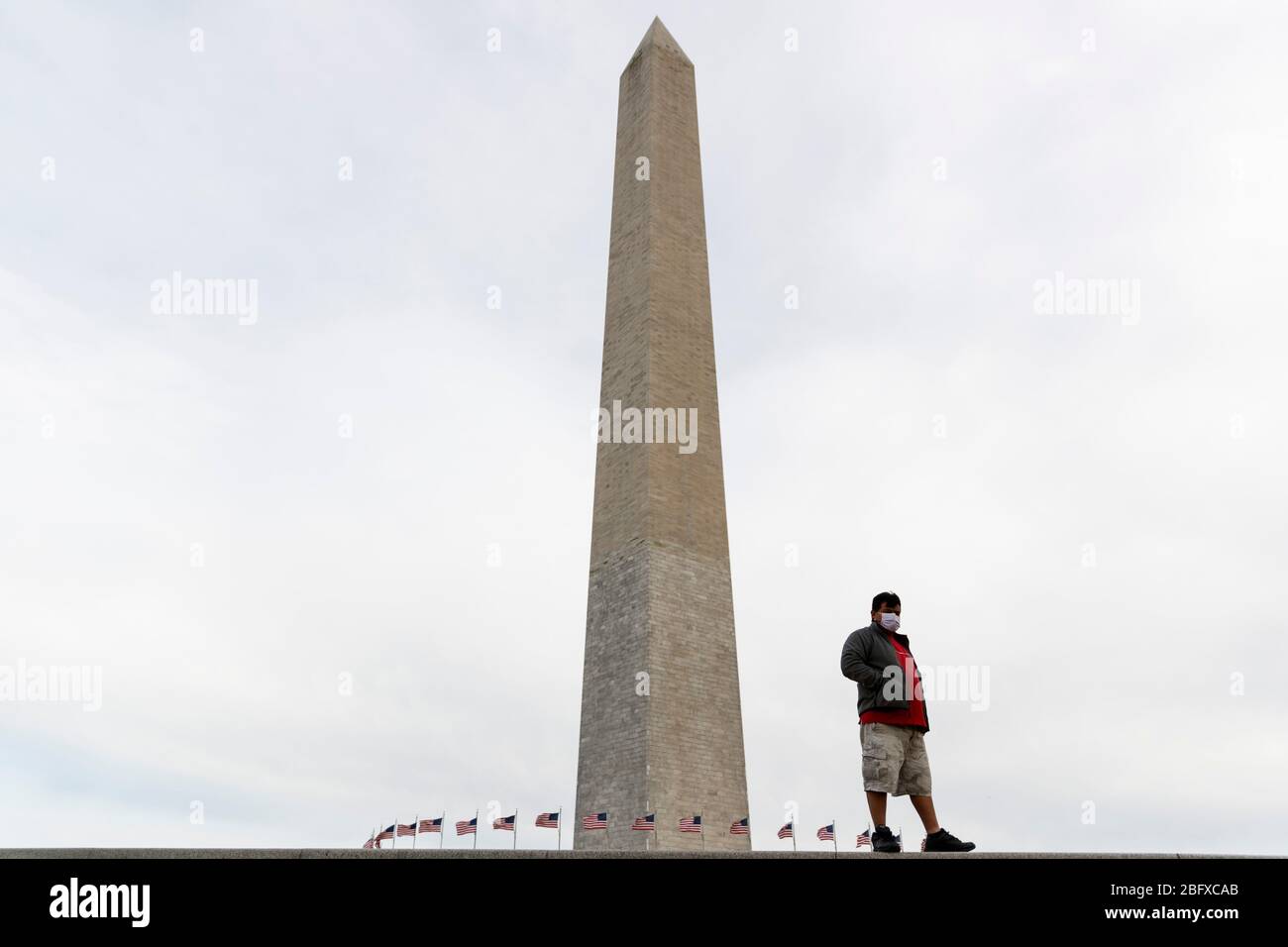 Washington, DC, USA. 19th Apr, 2020. A man wearing a face mask is seen ...